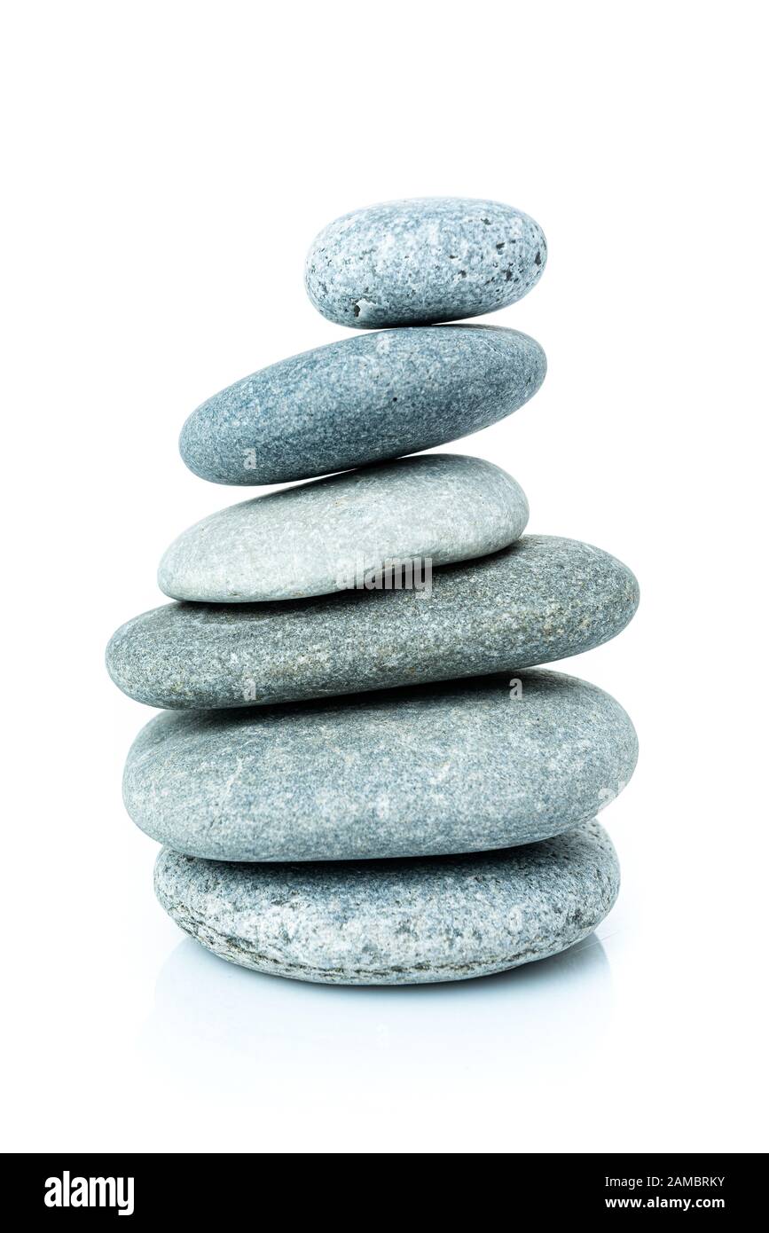 Stacked harmony stones in zen balance. pile of stones isolated on white ...
