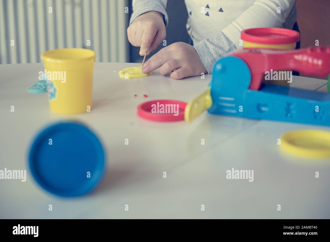 Detail of child's hand working with play dough Stock Photo - Alamy