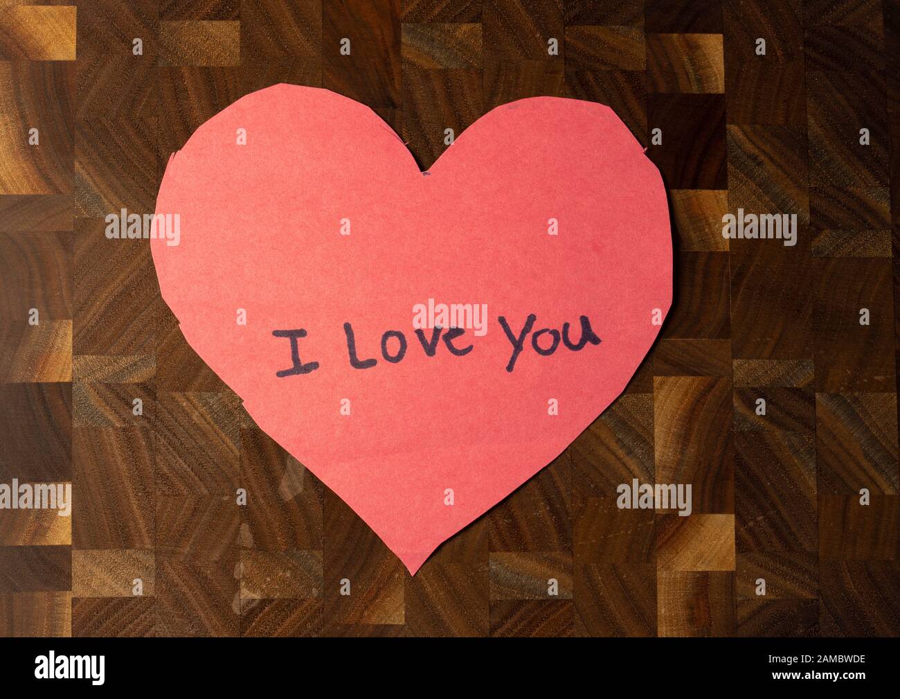 Pink, red, and white hearts with valentine messages in child’s writing ...