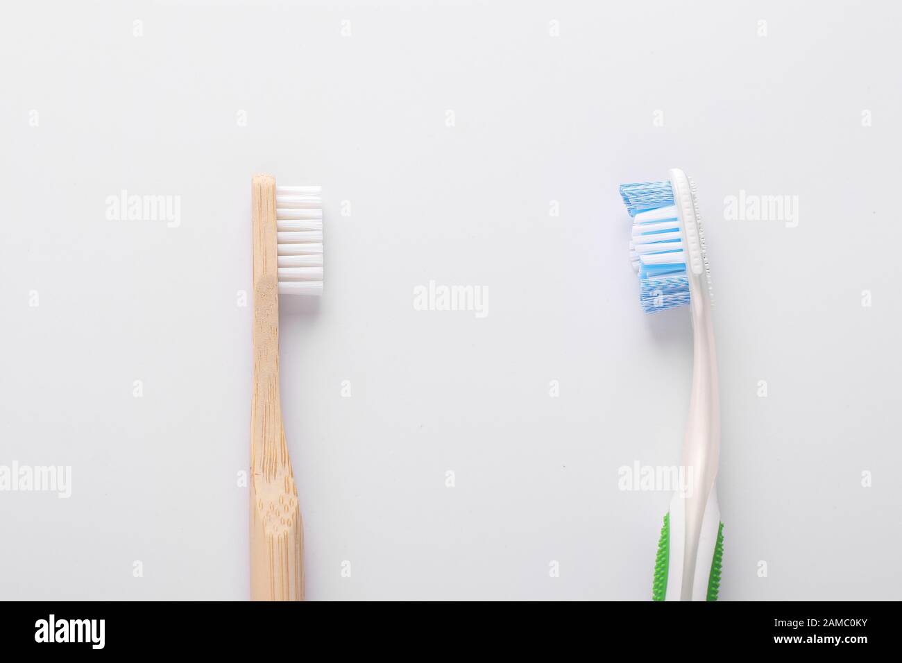 Zero waste concept, Eco wooden toothbrush vs plastic toothbrush on ...
