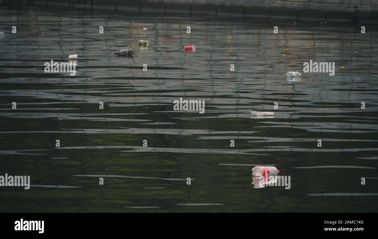 Trash floats in the city canal. Environmental pollution Stock Photo - Alamy