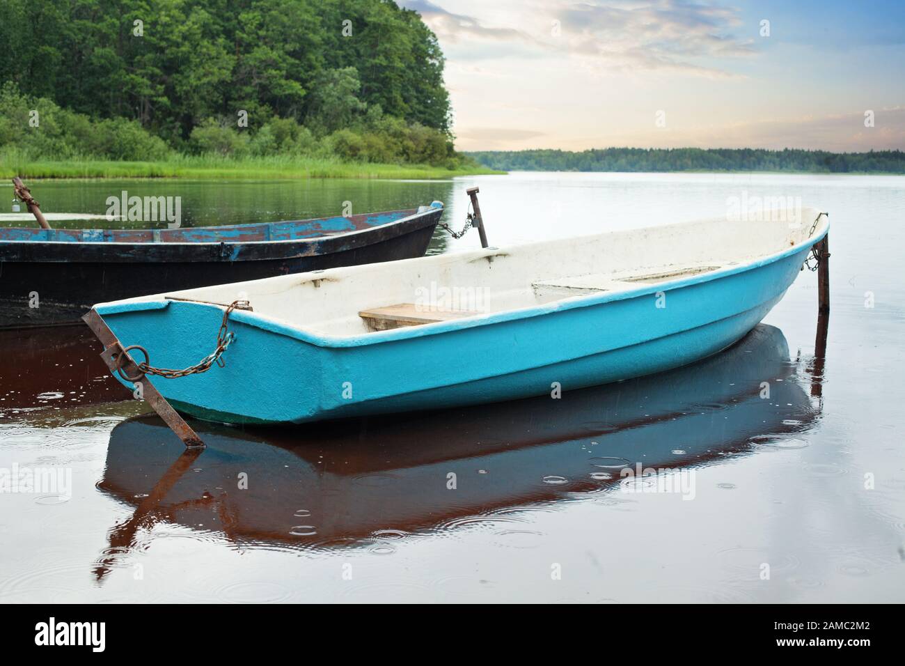 Boats On The Lake. Morning nature before fishing Stock Photo - Alamy