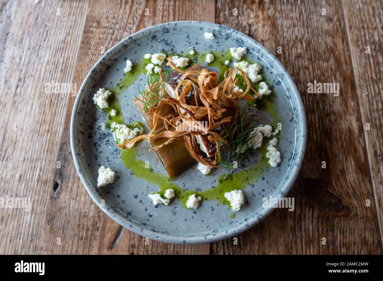 Blackened leek escabeche, parsnip crisps, curds, hot-smoked arctic char ...