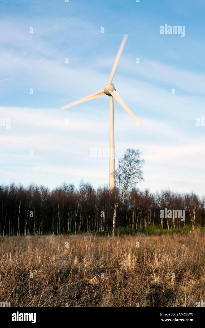 Three bladed wind turbine generator and pylon situated above Stracathro ...