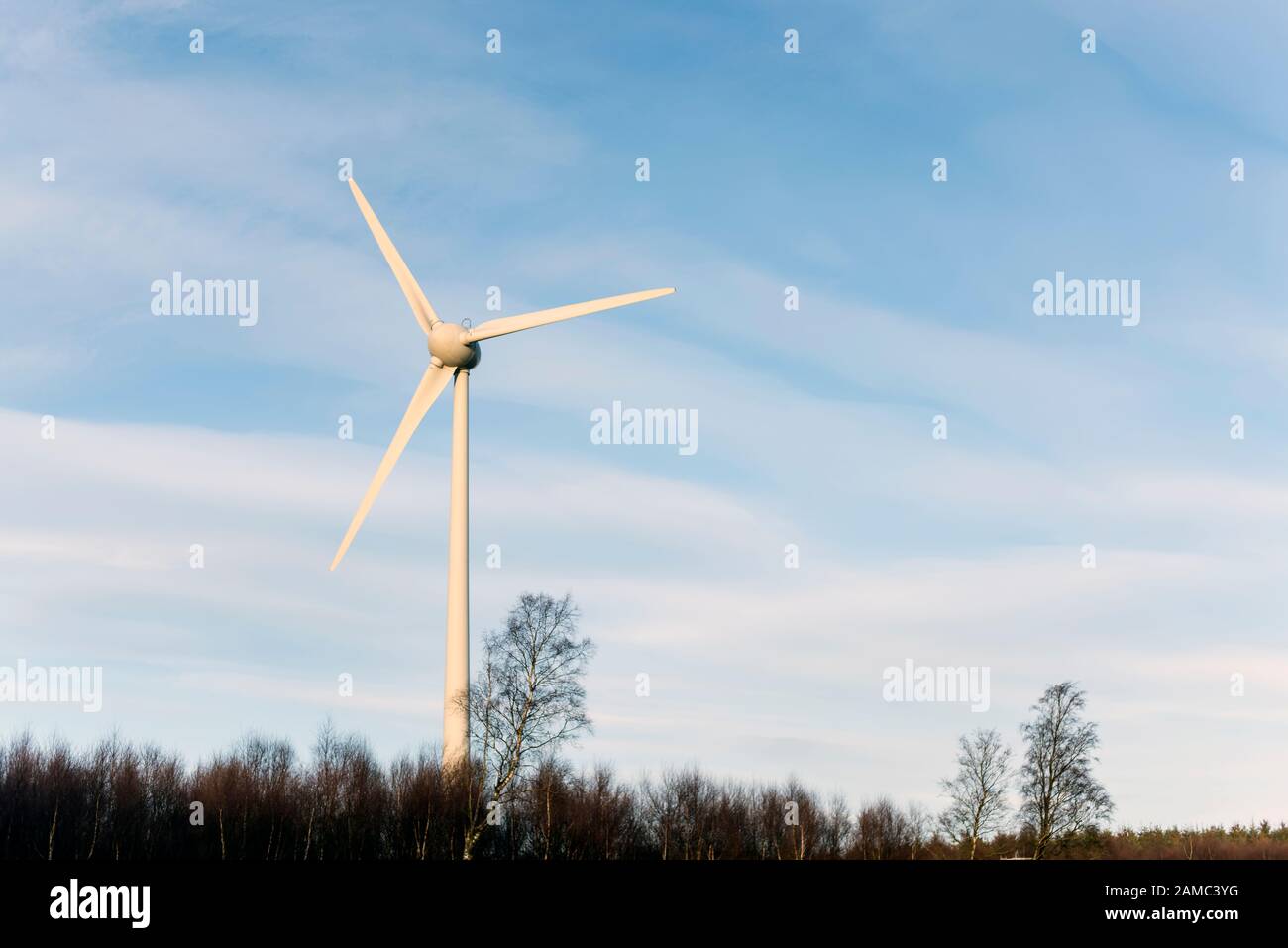Three bladed wind turbine generator and pylon situated above Stracathro ...