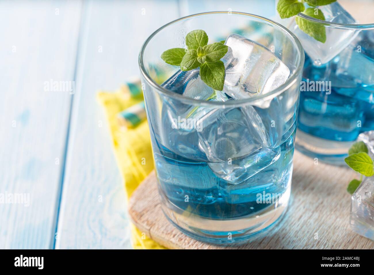 Blue lemonade in glasses on wood background Stock Photo - Alamy
