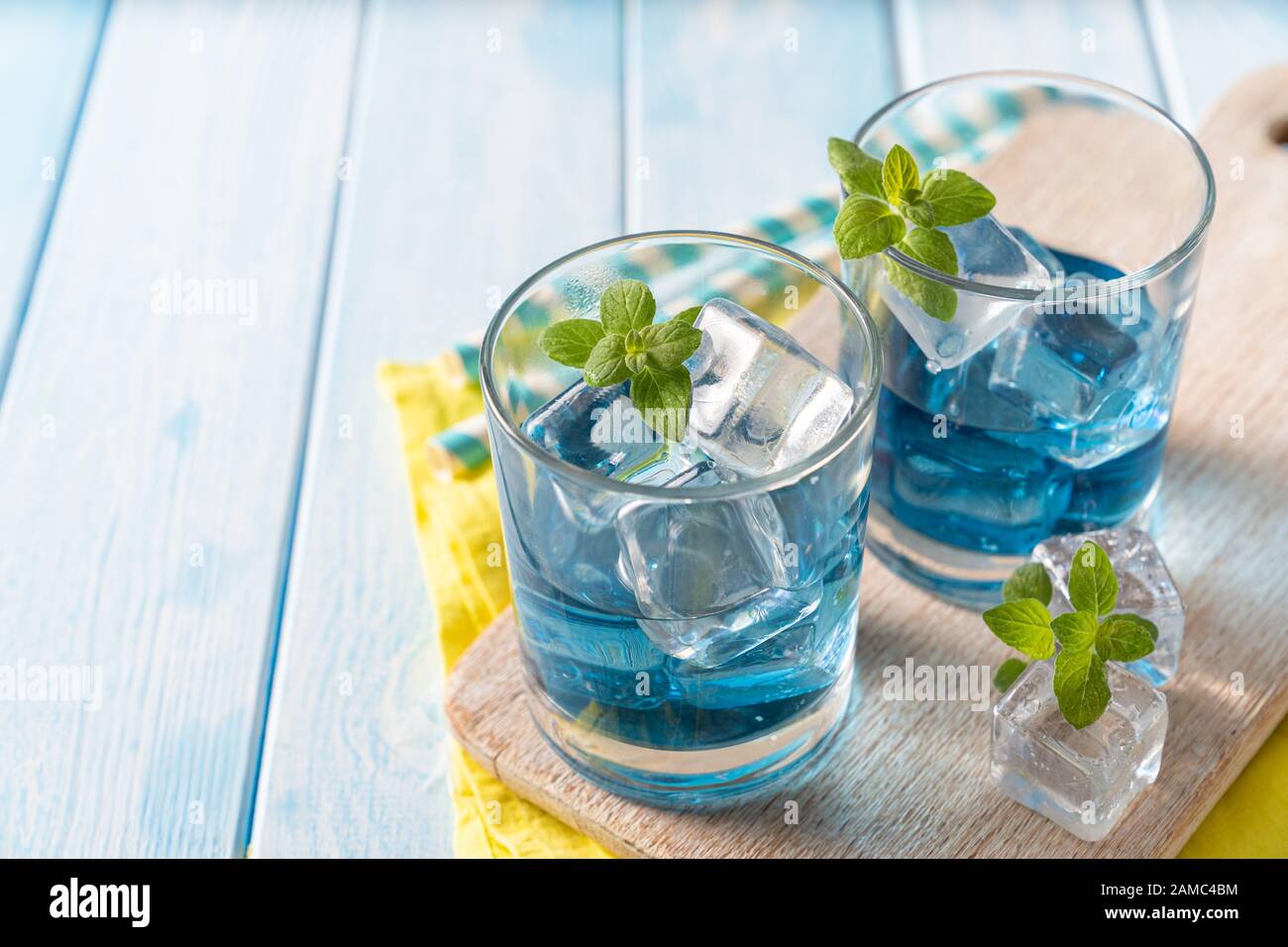 Blue lemonade in glasses on wood background Stock Photo - Alamy