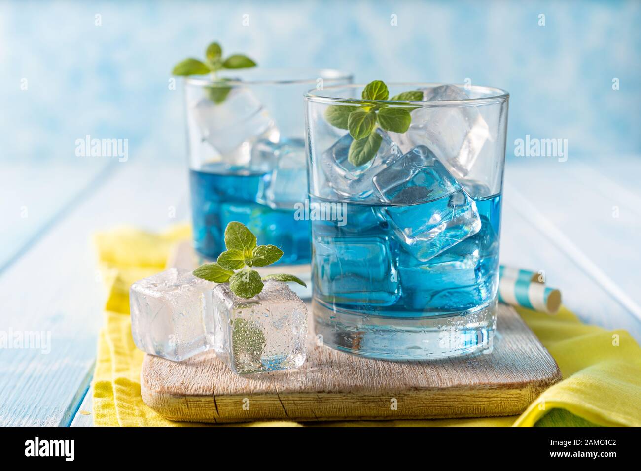Blue lemonade in glasses on wood background Stock Photo - Alamy