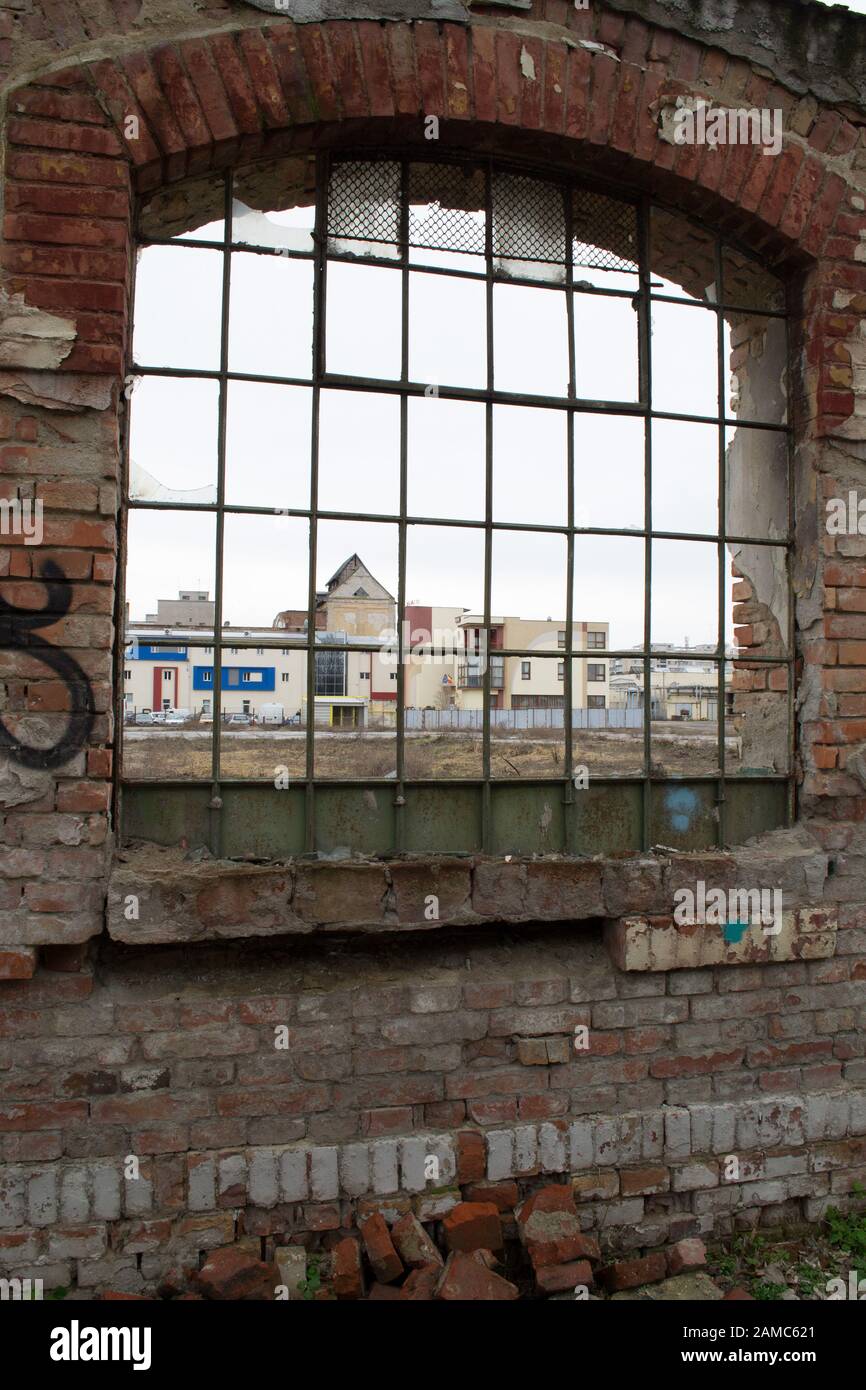 A view from a window of a demolished building, old factory. Weathered ...