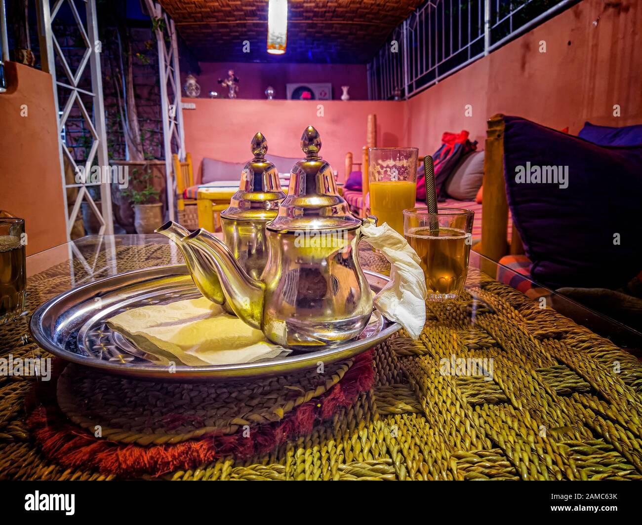 Fresh mint tea in typical tea metal pots and jars in a restaurant ...