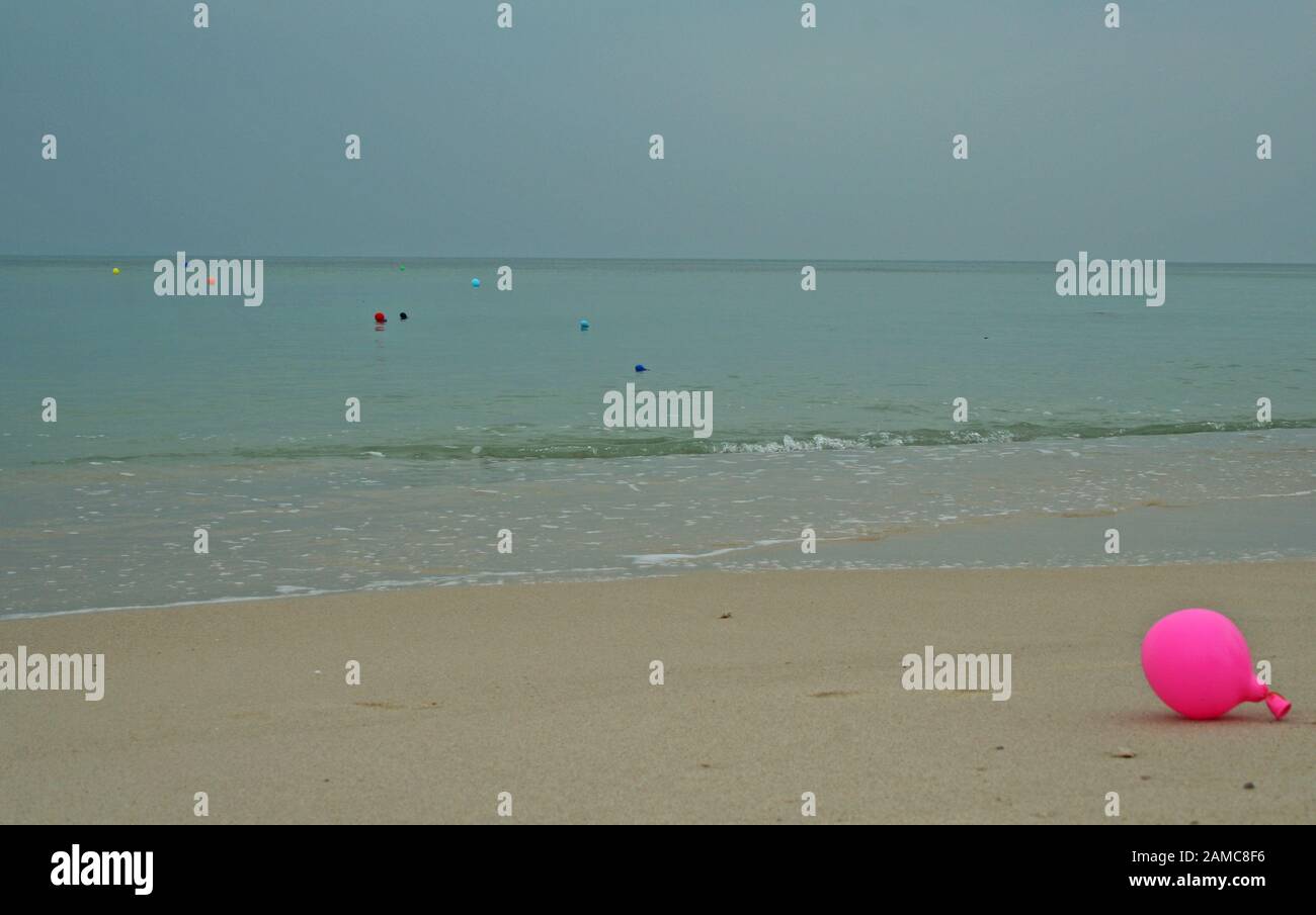 Balloons floating on the sea after a party. plastic pollution Stock ...