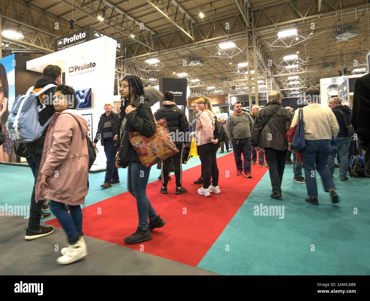 People walking around at a photography show indoor event Stock Photo ...