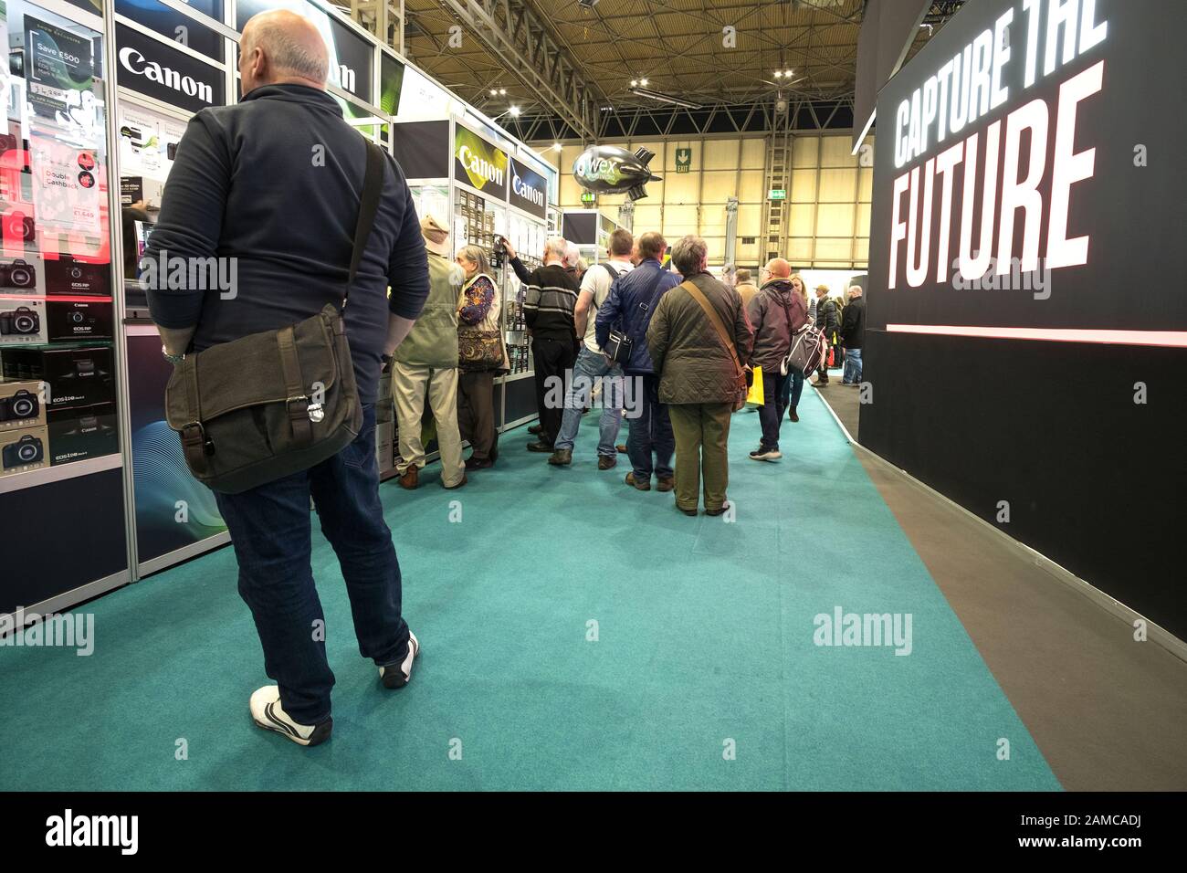 People walking around at a photography show indoor event Stock Photo ...