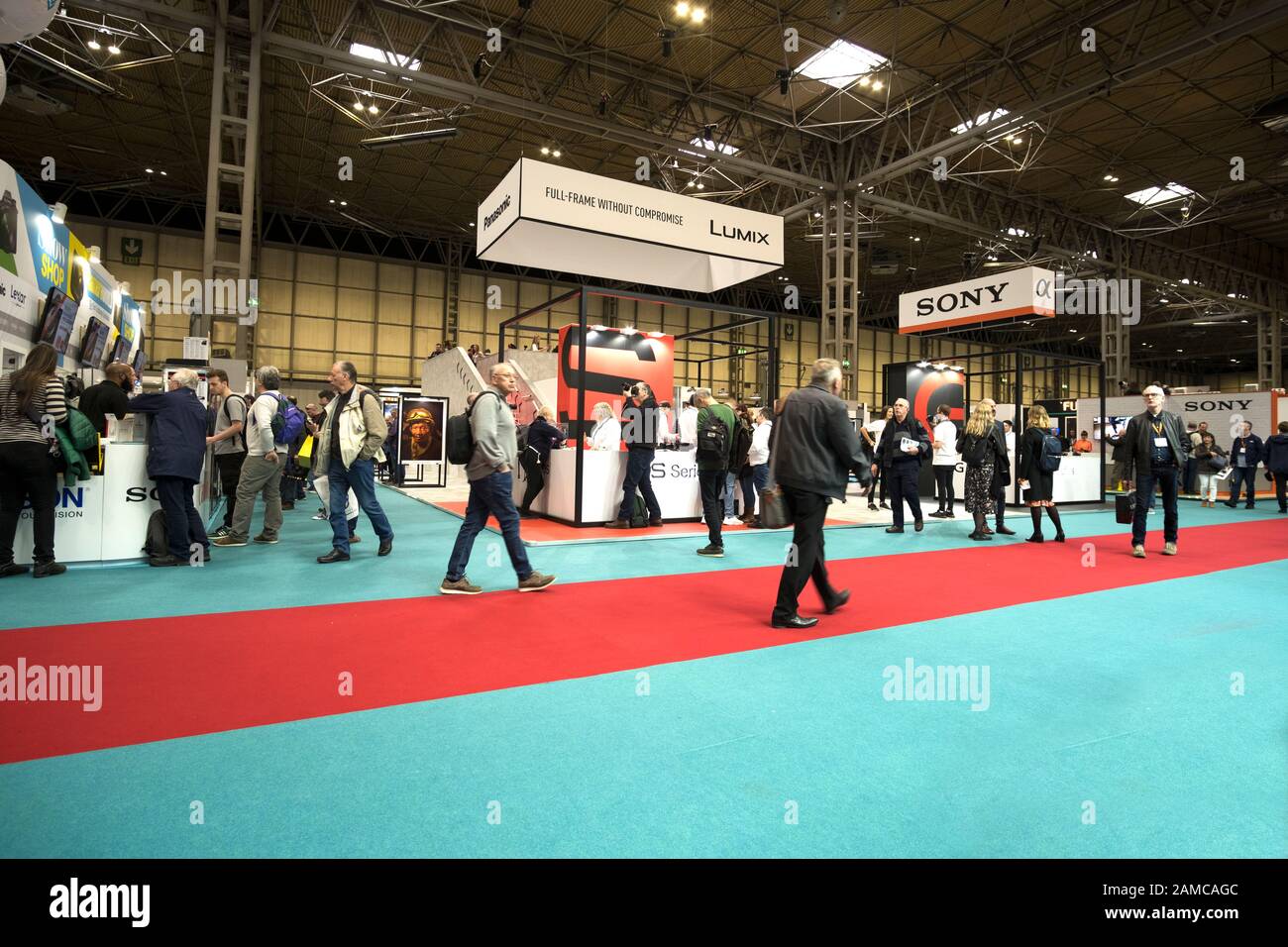 People walking around at a photography show indoor event Stock Photo ...