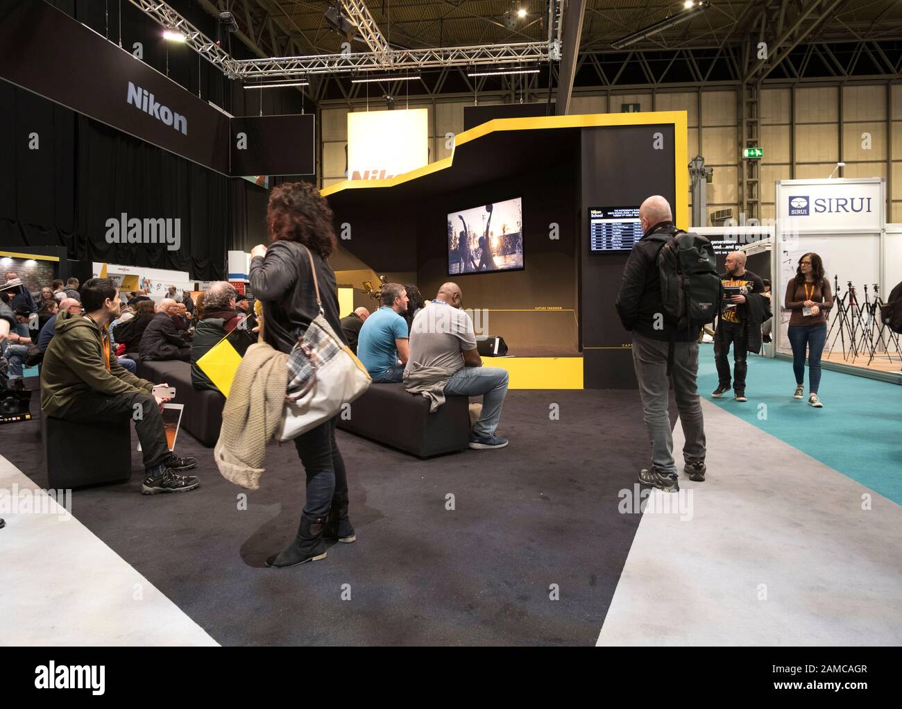 People walking around at a photography show indoor event Stock Photo ...