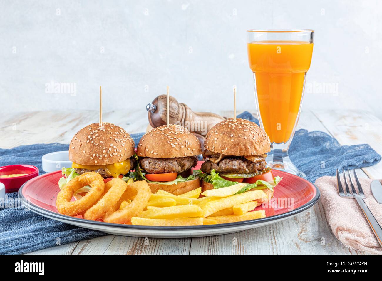 Three mini hamburger. Homemade delicious three mini burgers served with ...