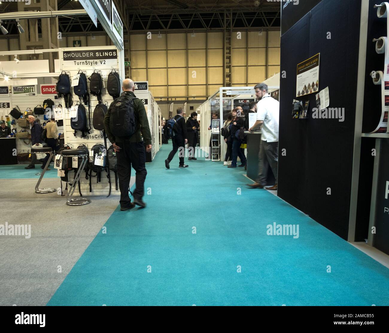 People walking around at a photography show indoor event Stock Photo ...