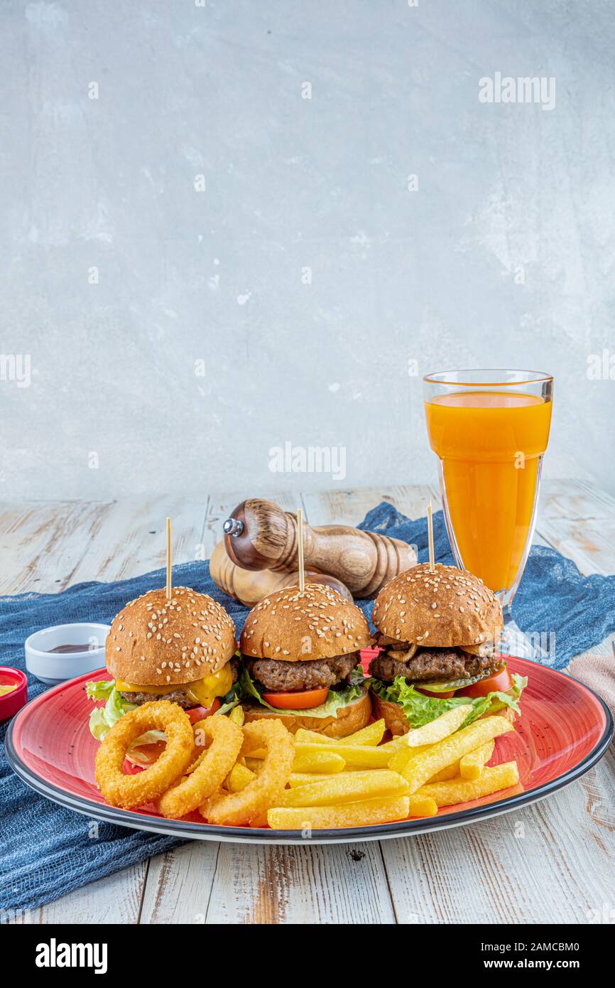Three mini hamburger. Homemade delicious three mini burgers served with ...