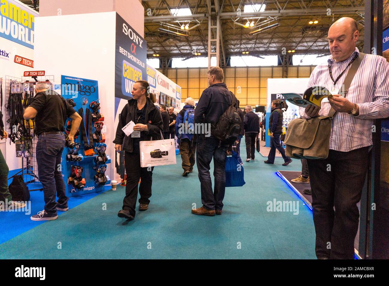 People walking around at a photography show indoor event Stock Photo ...