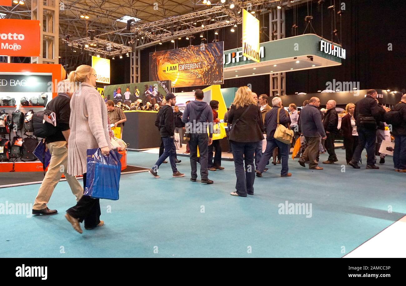 People walking around at a photography show indoor event Stock Photo ...