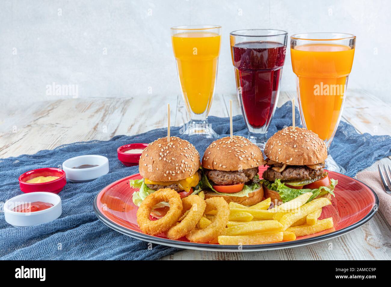 Three mini hamburger. Homemade delicious three mini burgers served with ...