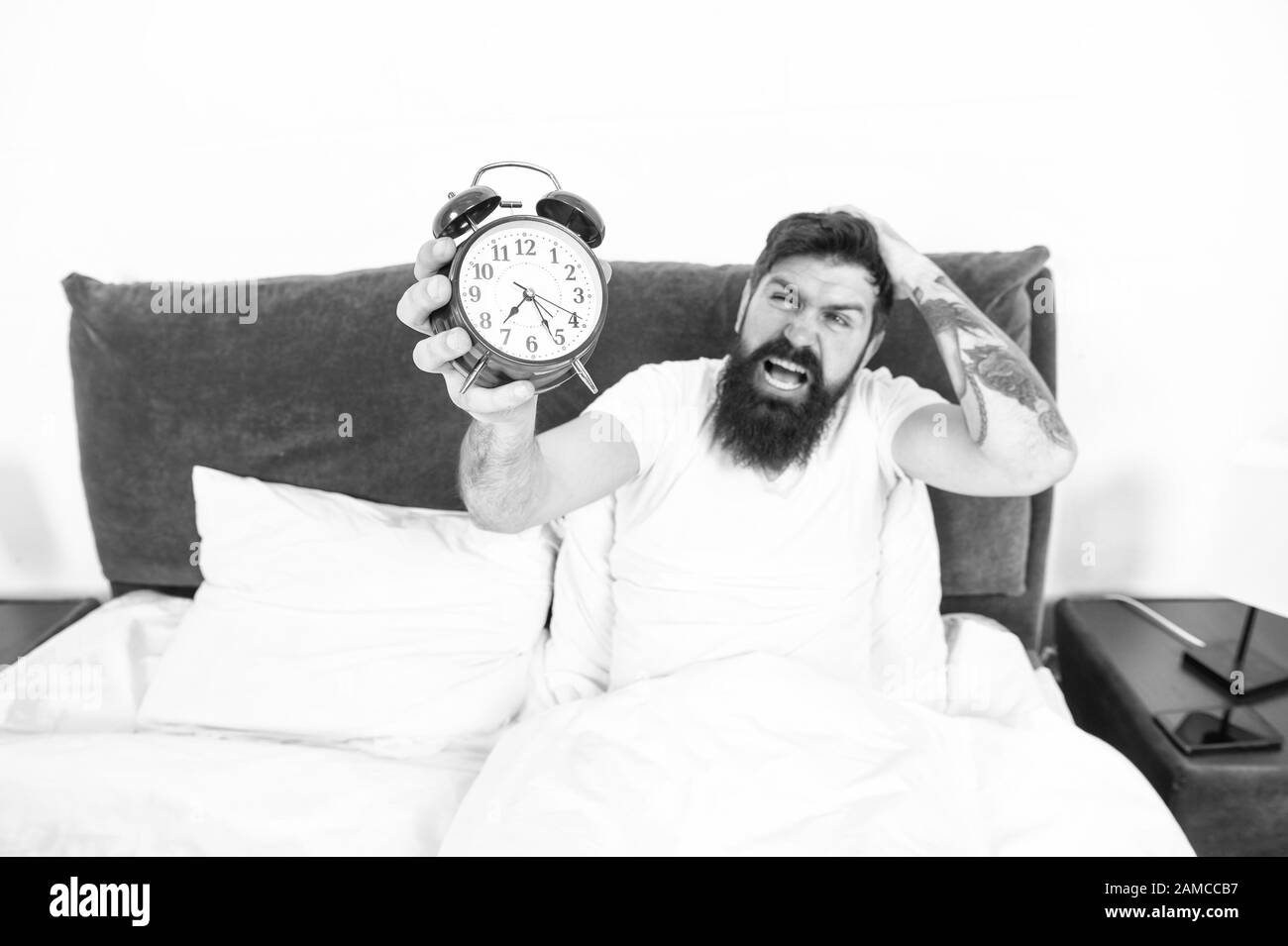 Angry man alarm clock Black and White Stock Photos & Images - Alamy
