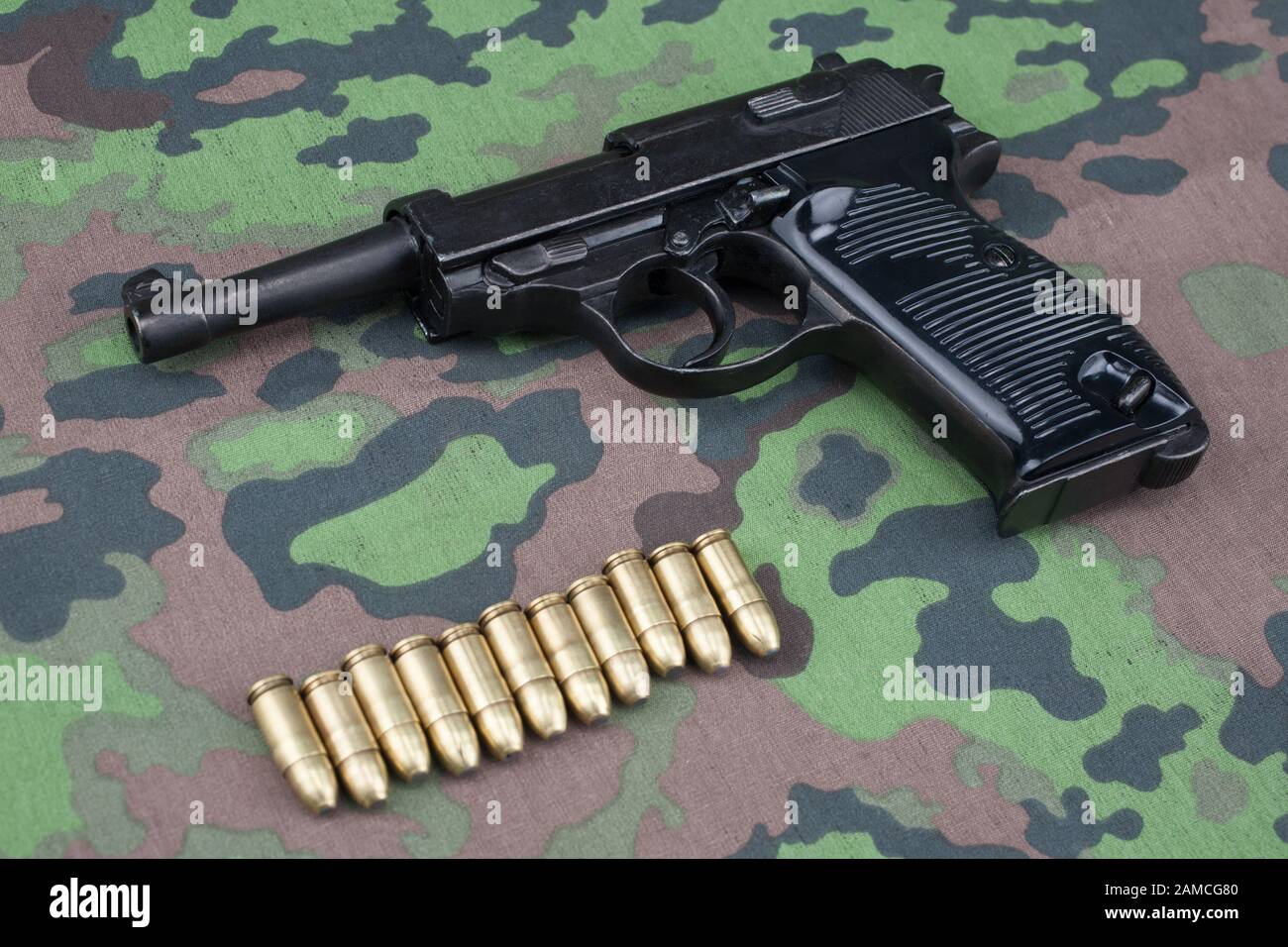 WWII era nazi german army 9 mm semi-automatic pistol with ammunition on ...