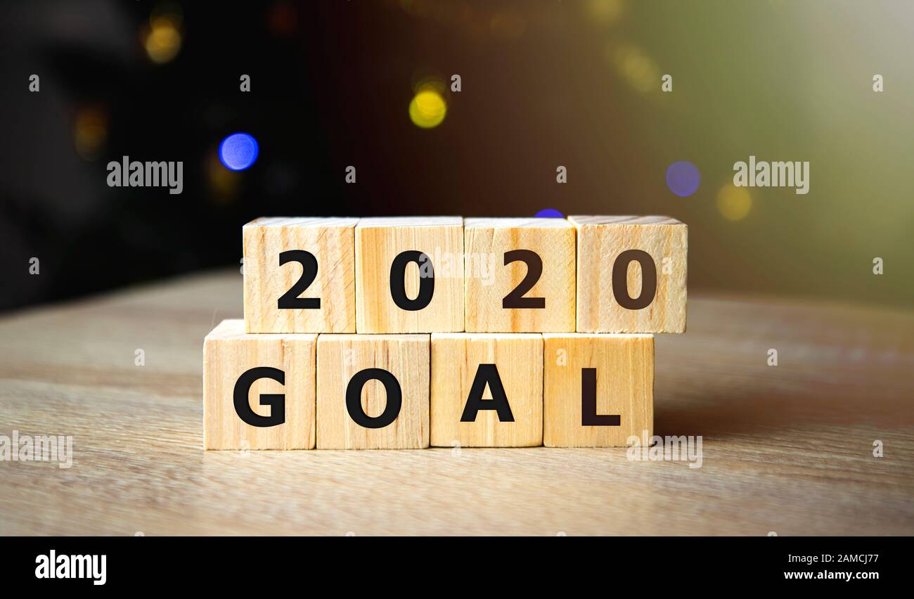 New year challenge, Hand holding 2020 goals on wooden box over marble ...