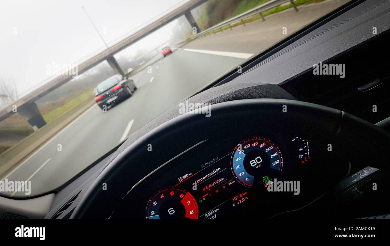 Driving car on highway in fog weather, interior driver angle of view ...