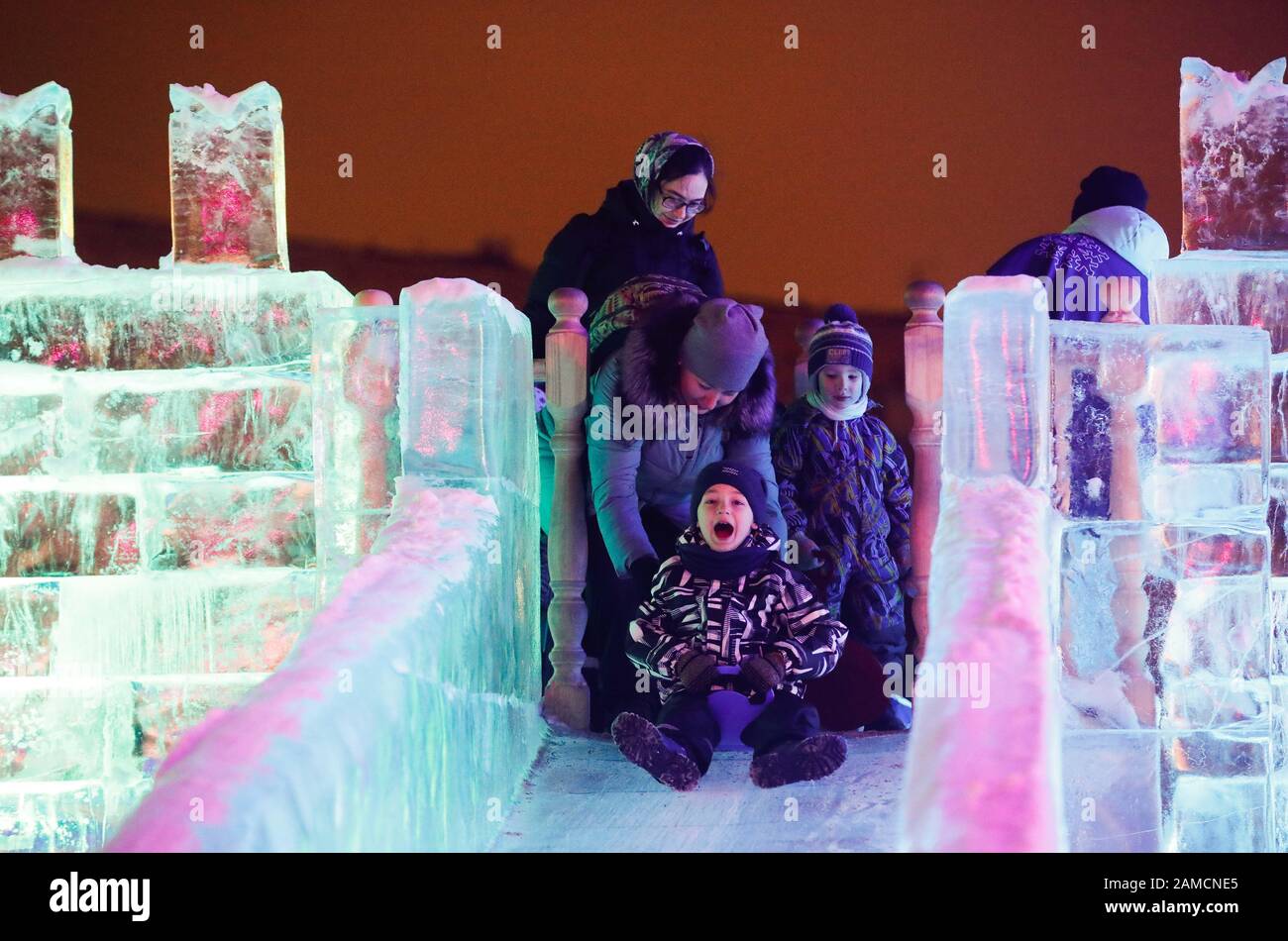 Moscow, Russia. 12th Jan, 2020. A child slides down an ice slide at the ...