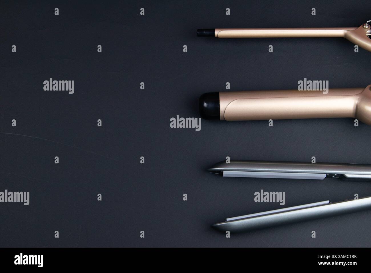 Composition of hairdressers instruments on black textured background ...