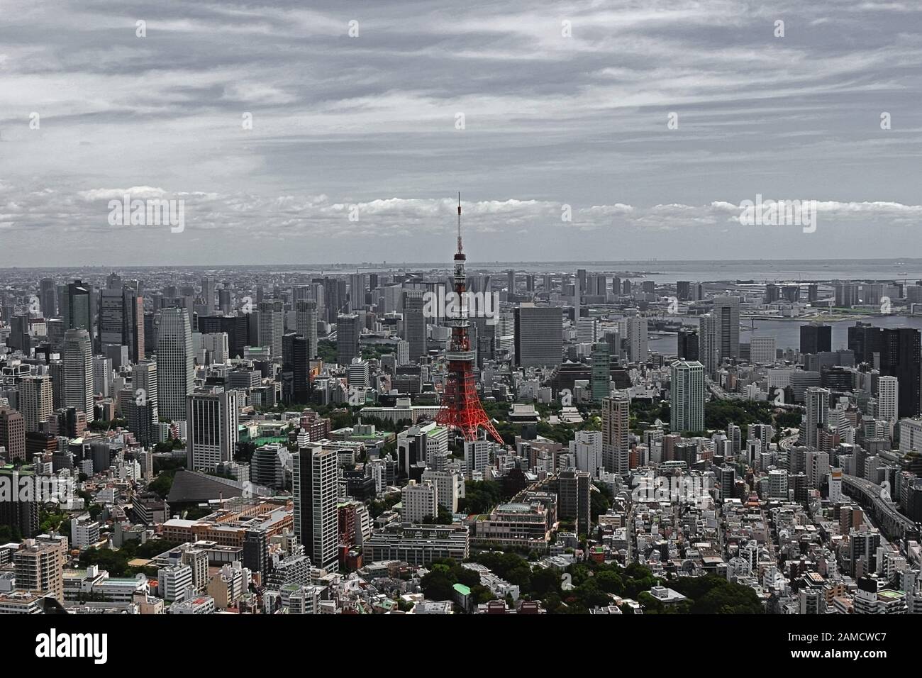 Red Tokyo Tower standing in the cityscape of gray colors Stock Photo ...