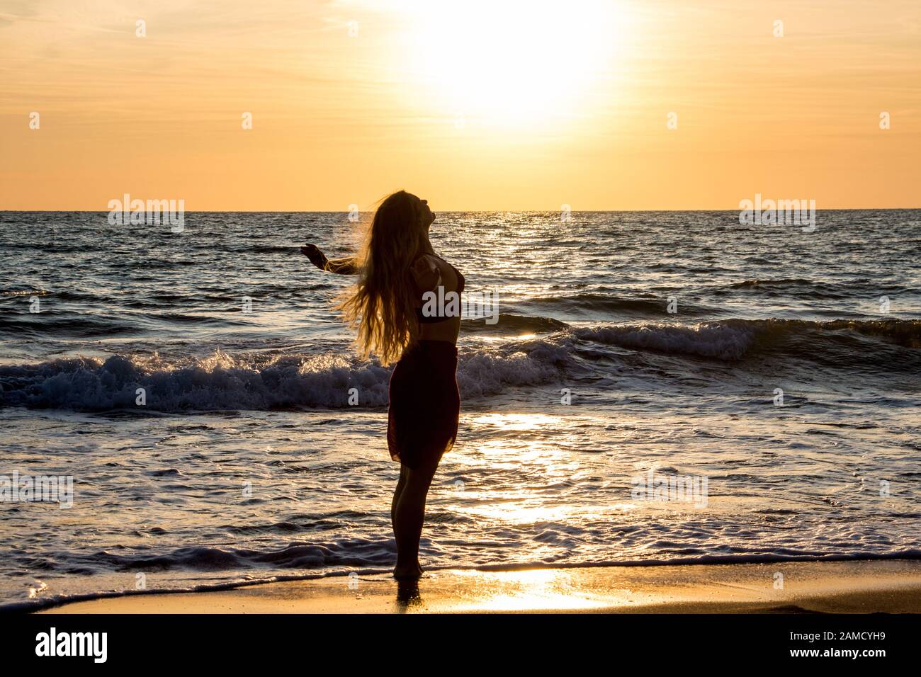 Lonely Dancer Ballet Posing On The Beach Sunset Silhouette Sea Stock