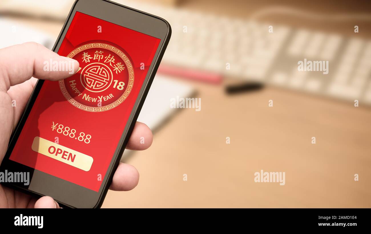 Hand holding smart phone with digital red packet for Chinese new year ...