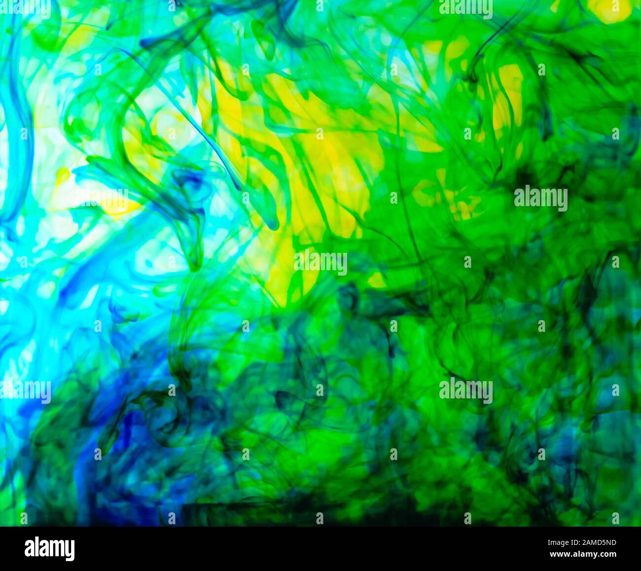 Blurred photo of food color drop and dissolve in water for background ...