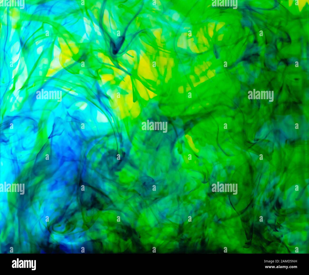 Blurred photo of food color drop and dissolve in water for background ...