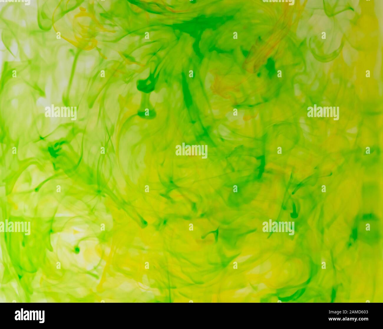 Blurred photo of food color drop and dissolve in water for background ...