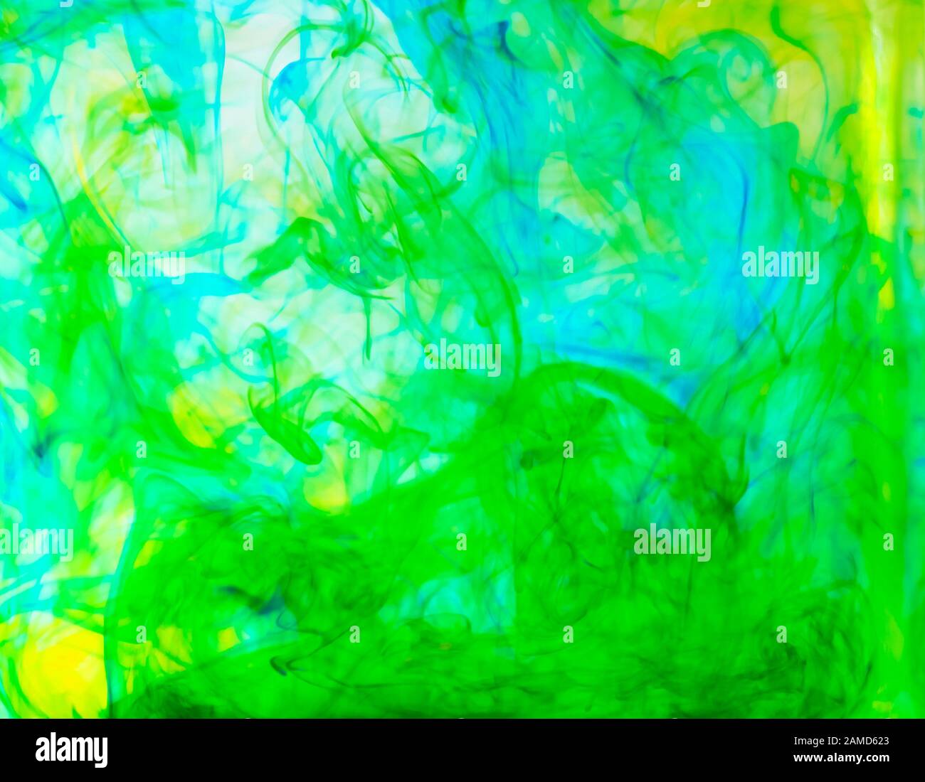 Blurred photo of food color drop and dissolve in water for background ...