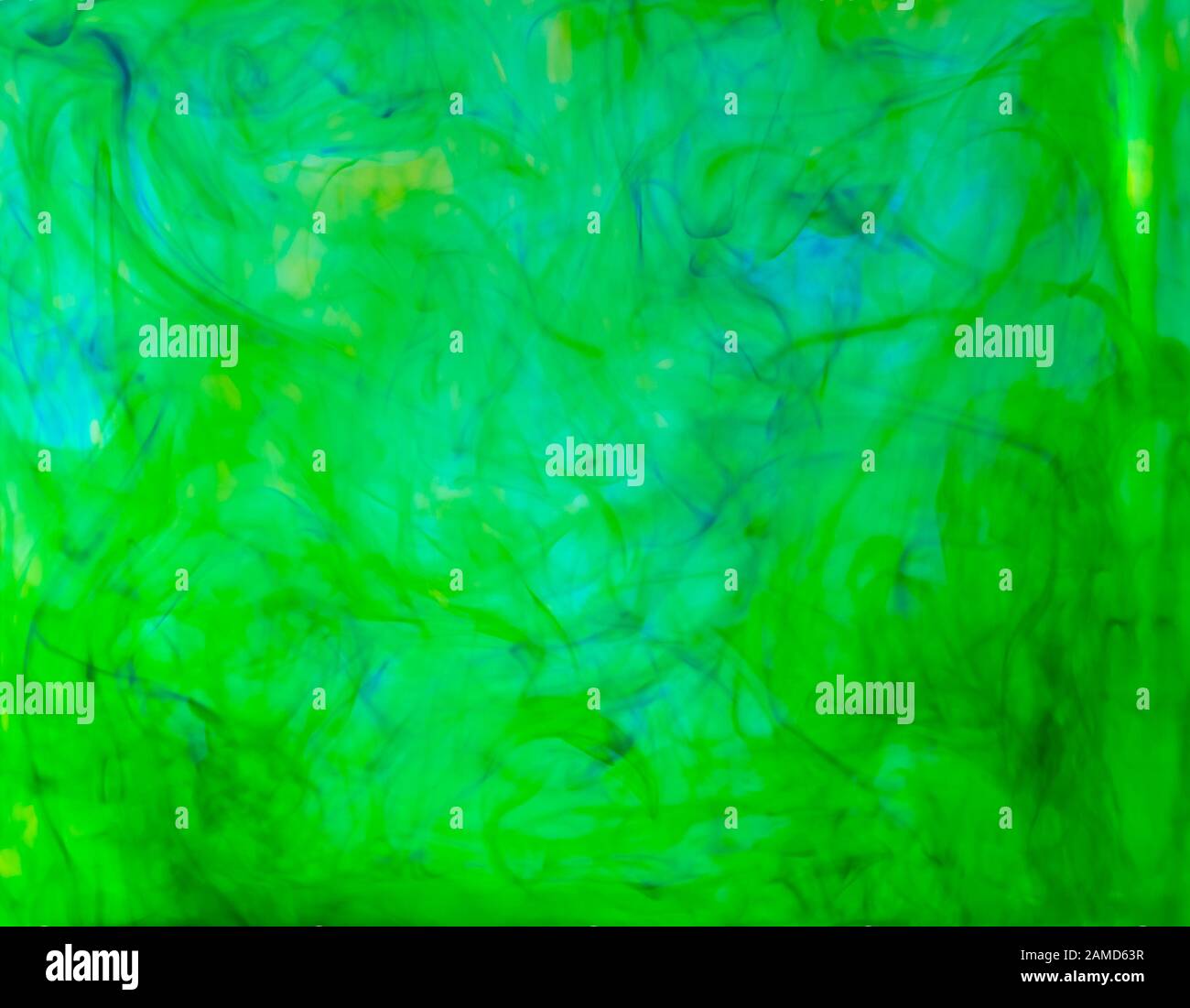 Blurred photo of food color drop and dissolve in water for background ...