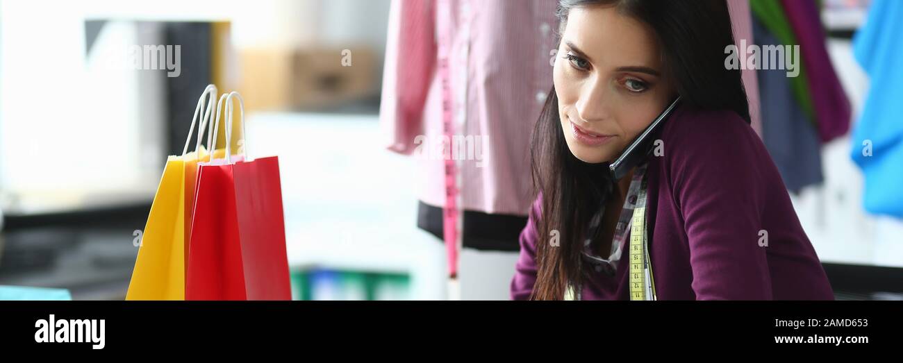 Young busy tailor Stock Photo - Alamy