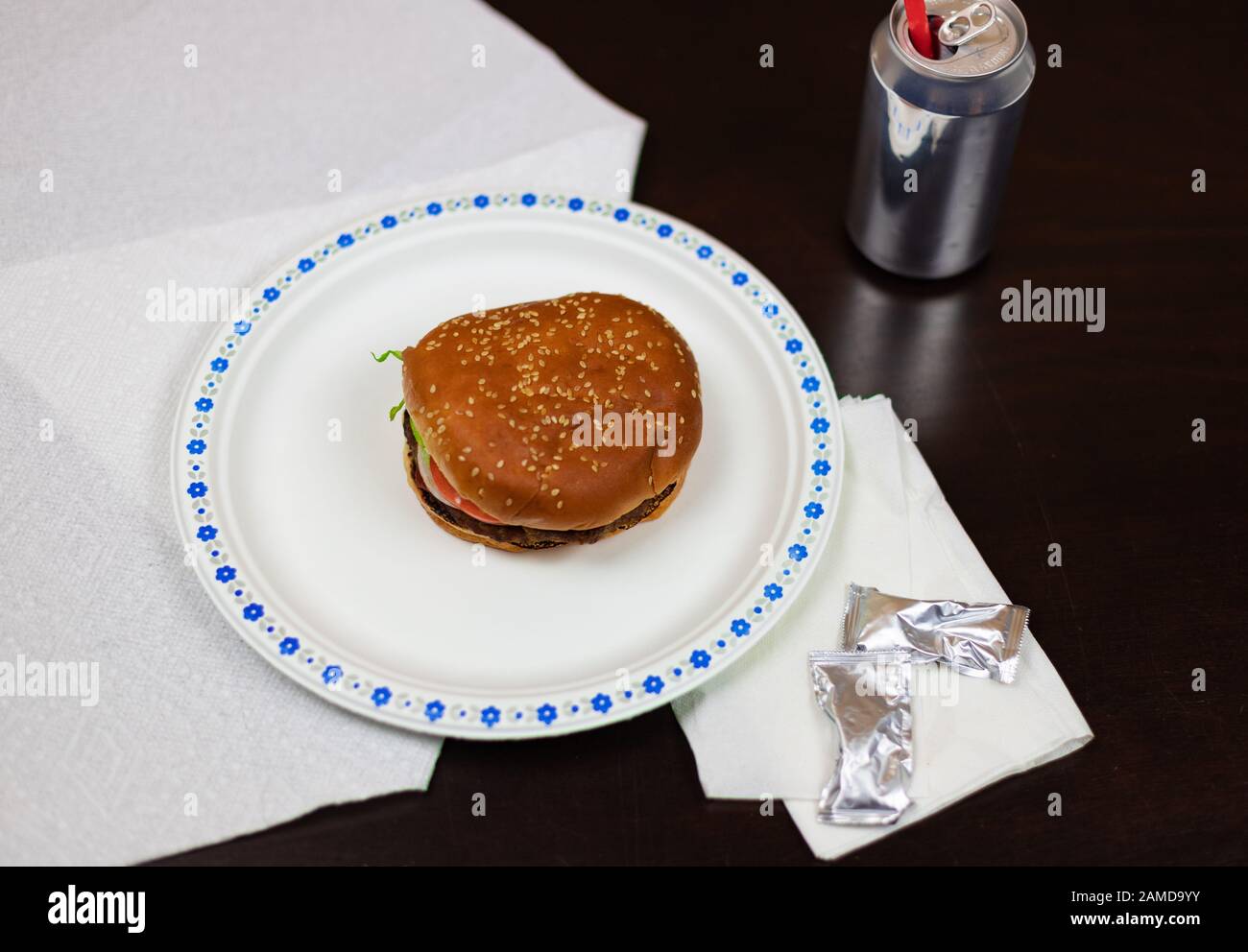 Burger on a paper plate top view. Minimalism Stock Photo - Alamy