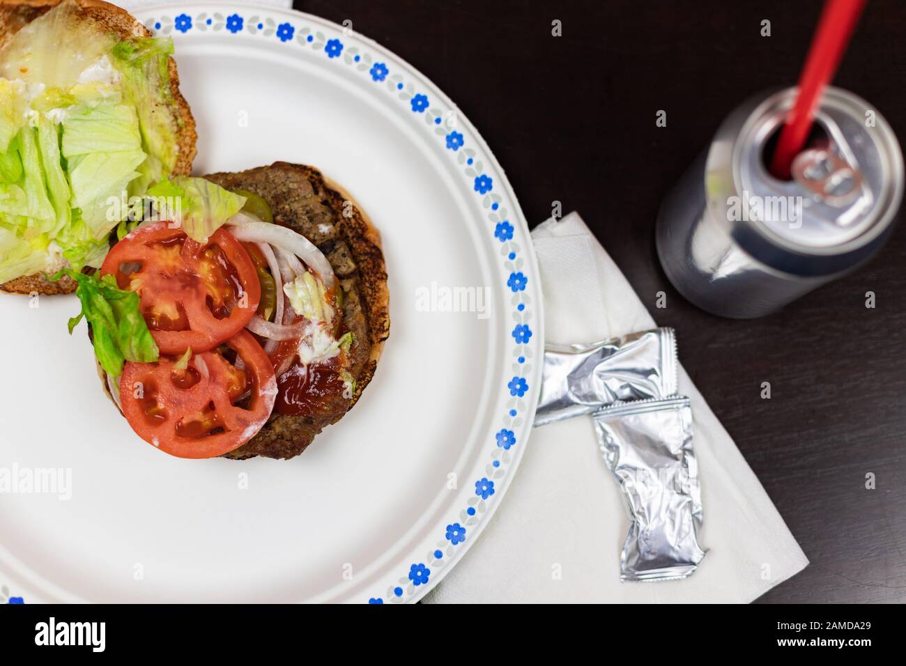 Burger on a paper plate top view. Minimalism Stock Photo - Alamy