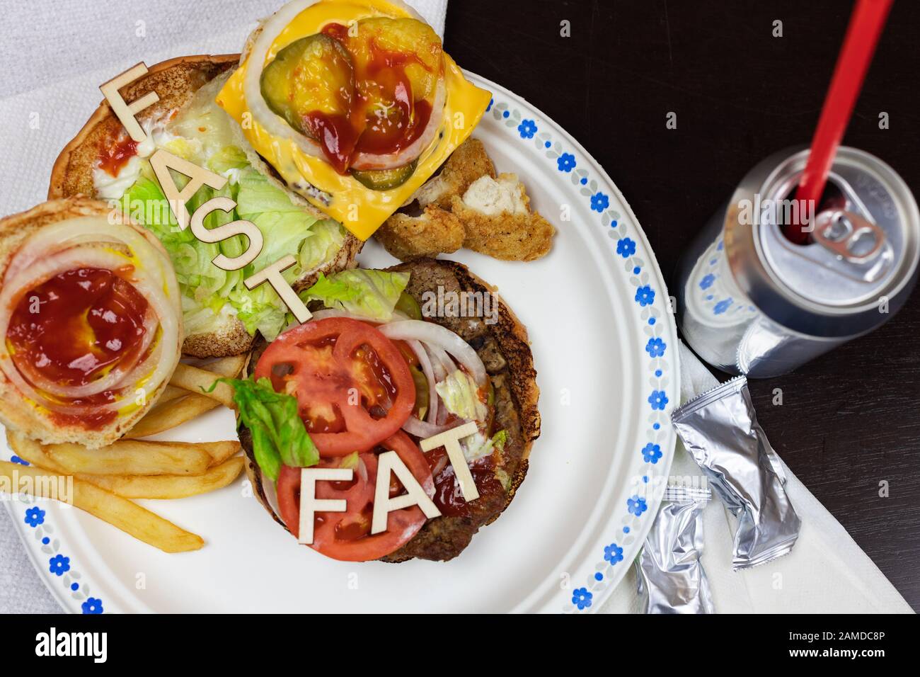 Got fat? letters on a juicy burger Unhealthy eating. Junk food concept ...