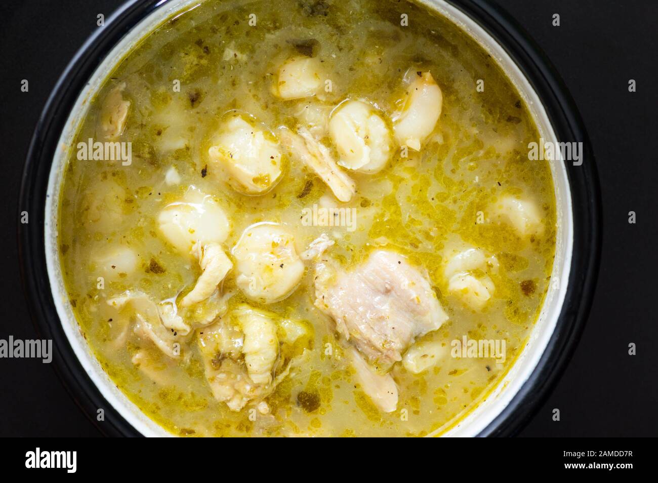 Pozole verde, or green posole is traditionally made with hominy and ...