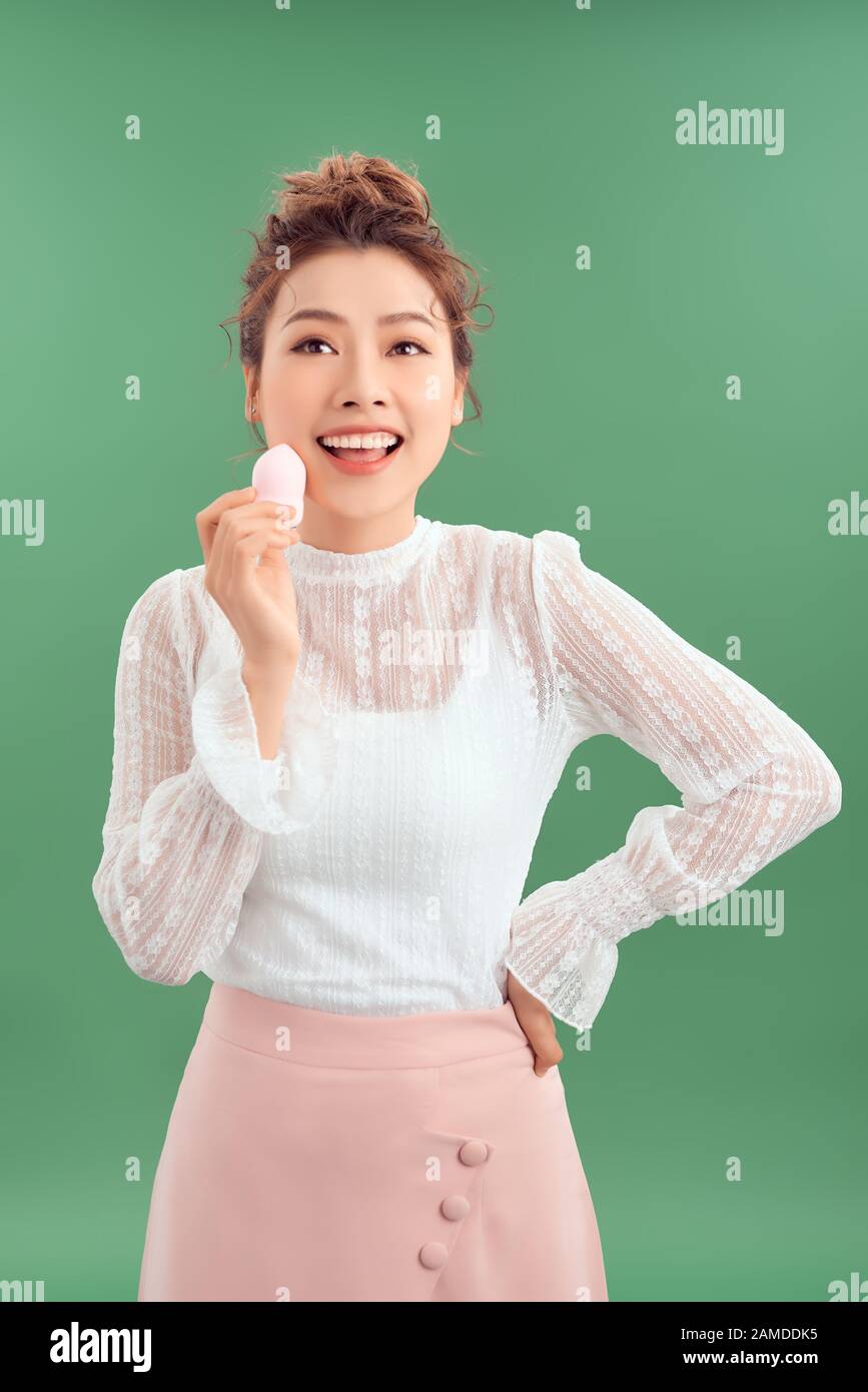 Beauty portrait of a lovely young asian woman standing isolated over ...