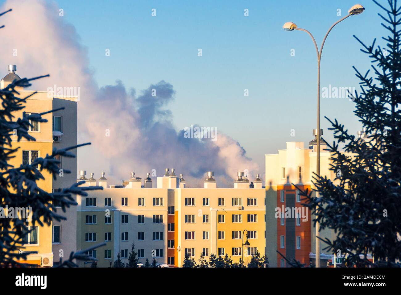 lots of smoke behind the houses Stock Photo - Alamy