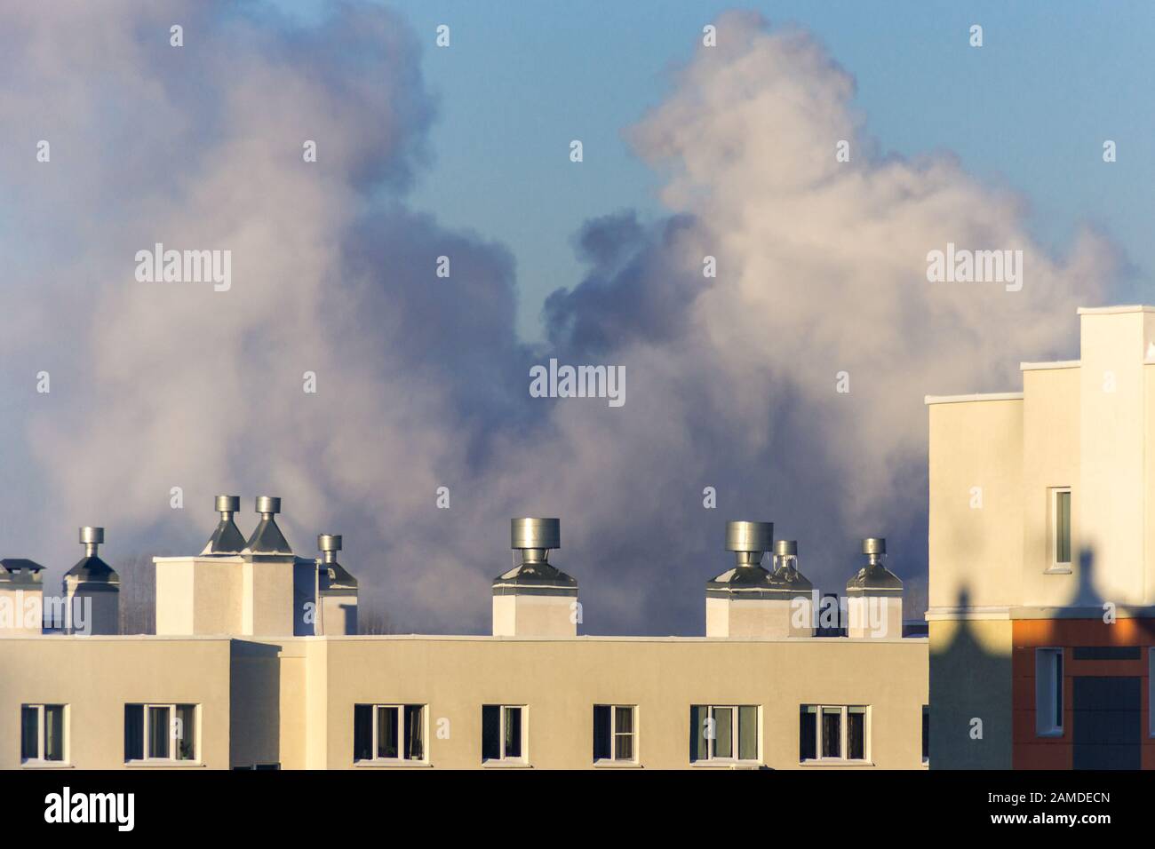 lots of smoke behind the houses Stock Photo - Alamy