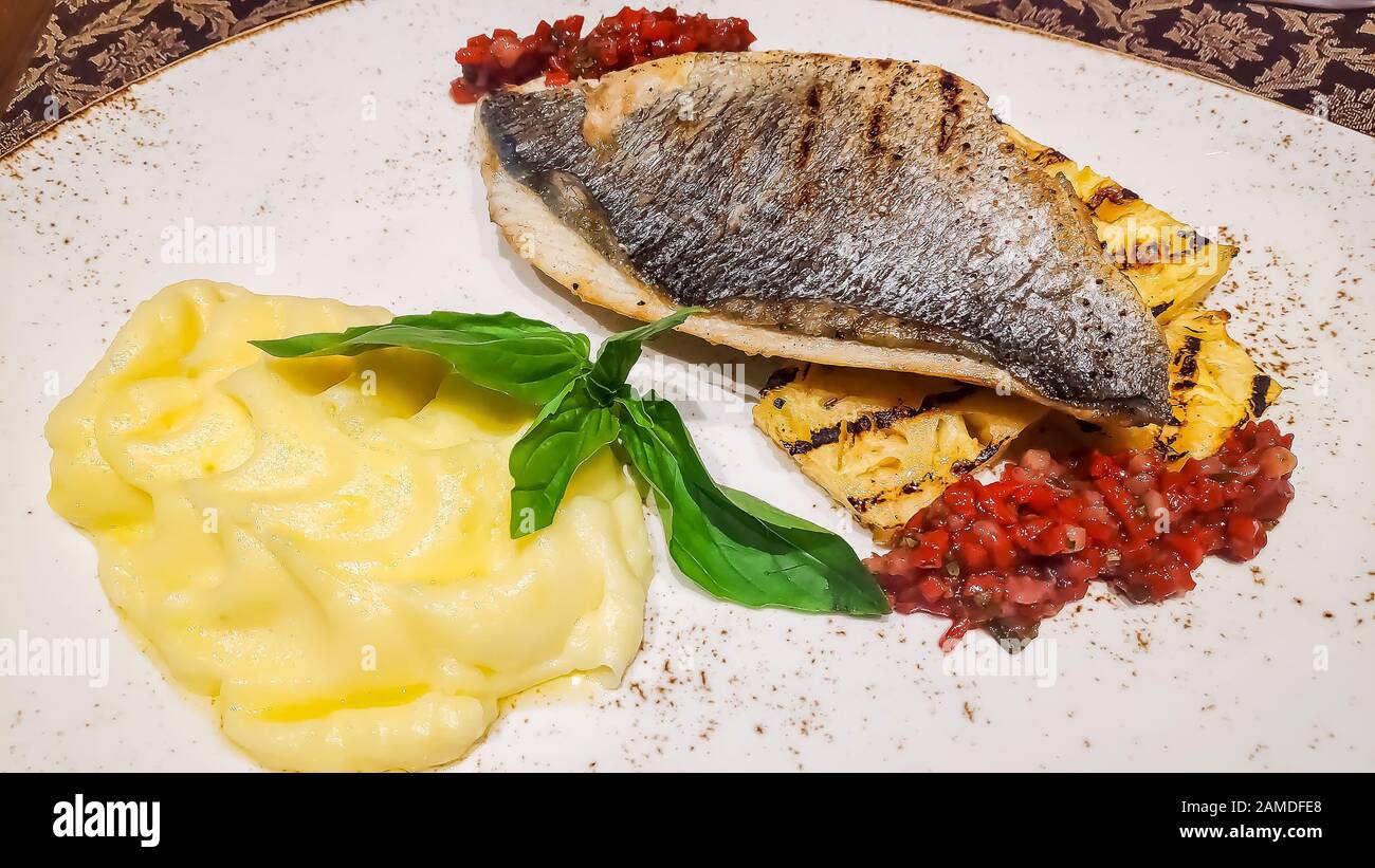 Fried Norwegian skrei cod fish filet with mashed potatoes, mushroom and ...