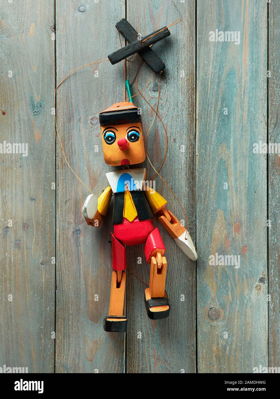 Pinocchio wooden string doll. Photographed as if he was walking with ...