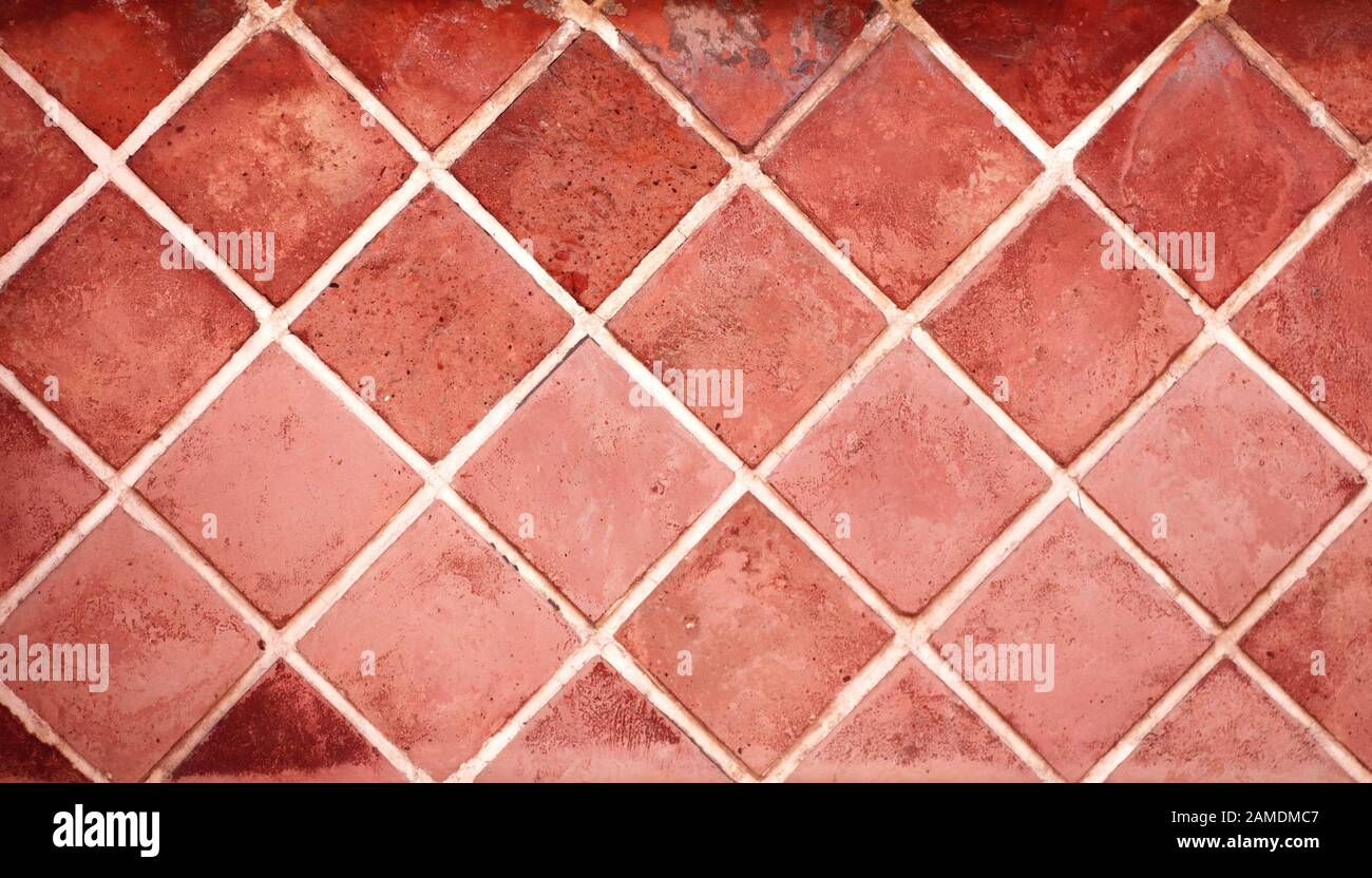Old porcelain tiles floor texture with tiles of red color and cement of ...